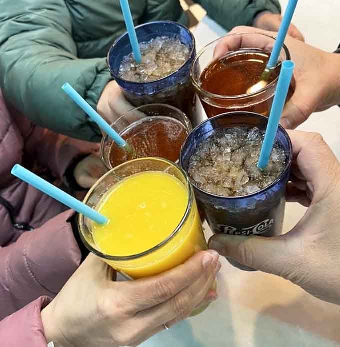 A rainbow of beverages gathered together like old friends, ready to wash down whatever deliciousness you've just ordered.