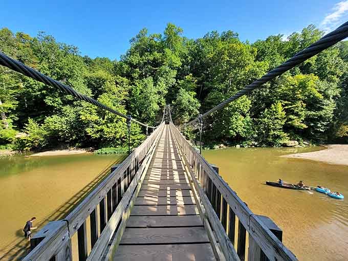The suspension bridge stretches toward adventure, swaying just enough to remind you that life's best moments involve slight uncertainty.
