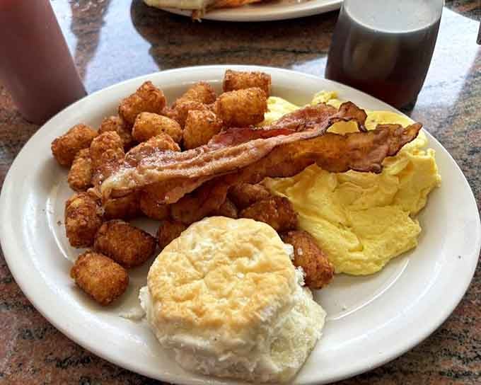 Eggs, bacon, and those golden tater tots create a breakfast plate that would make your grandmother proud and slightly jealous.