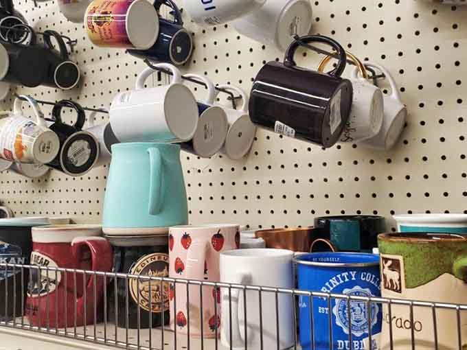 Coffee mugs from college towns to tropical paradises create a ceramic timeline of American travel dreams and destinations.