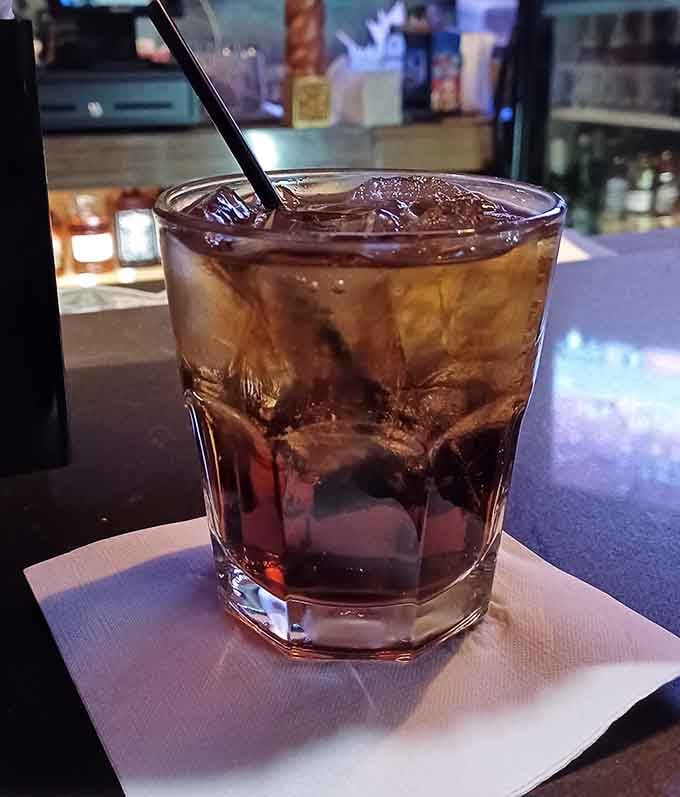 A perfectly poured cocktail over ice, liquid courage for both grilling and potential karaoke performances ahead.