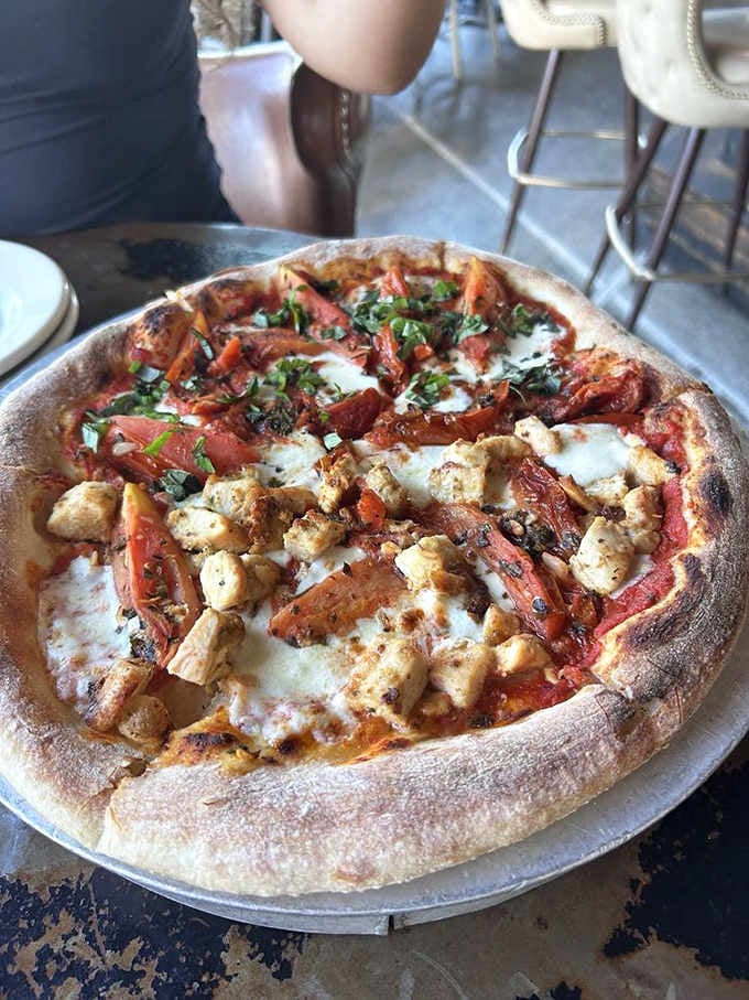 Coal-fired pizza with perfectly charred crust shows this garage knows its way around more than just burgers.