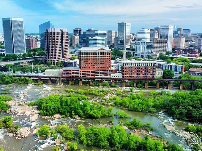 Richmond's skyline along the James River represents the urban energy waiting beyond those highway welcome signs.