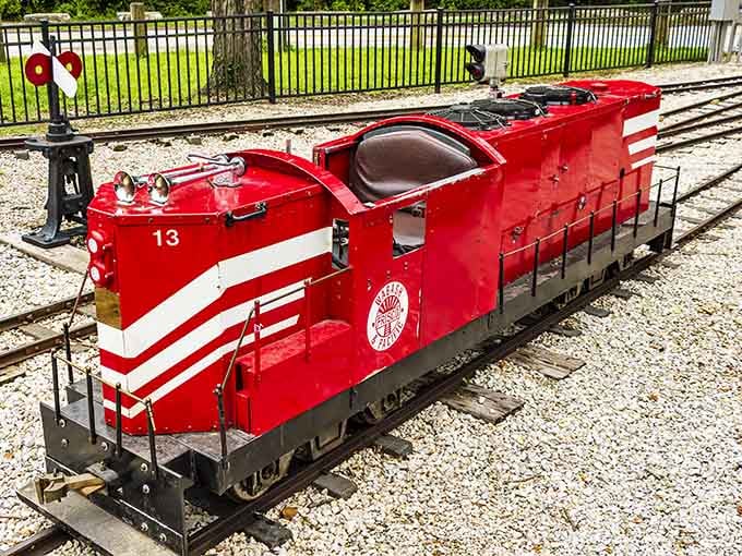 This bright red diesel locomotive looks ready to lead a parade, or at least a very cheerful train ride.