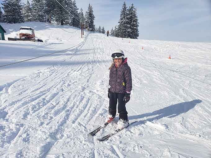 Winter transforms the landscape into a snowy playground where ski lessons actually feel like fun, not torture.