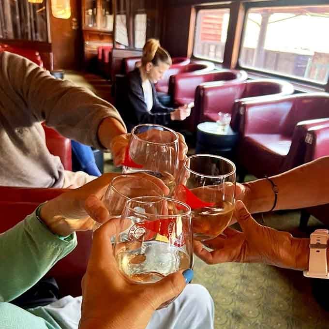 Champagne glasses clink aboard the moving lounge, because sophisticated day drinking absolutely counts when there's a bar involved.