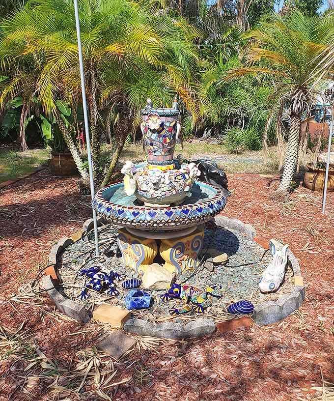 This mosaic fountain transforms discarded pottery into something your grandmother would actually approve of for once in her life.