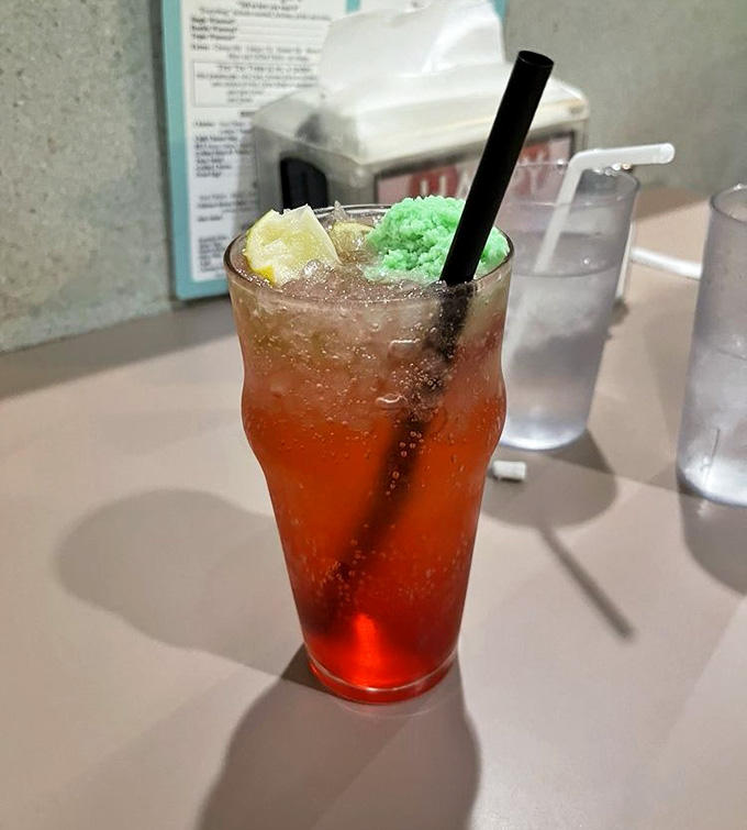 That cherry limeade sparkles like a liquid ruby, refreshing enough to make you forget about your fancy craft cocktails.