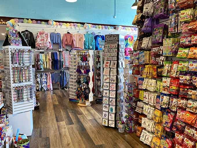 Clothing and stickers prove this place understands that memories are better when you can wear them home proudly.