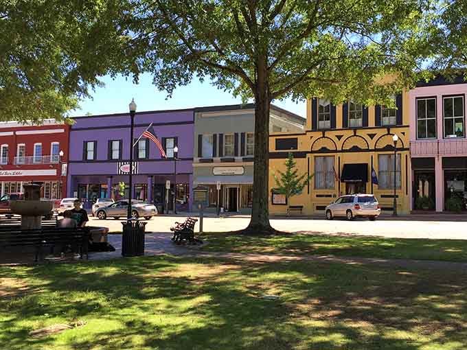 The massive oak tree shading the square has probably witnessed more town gossip than the local beauty parlor.