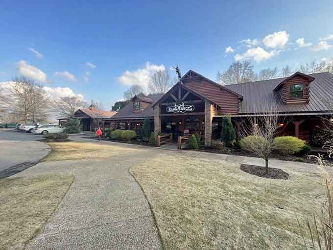 Log cabin construction and natural stone create that hunting lodge vibe where every meal feels like a celebration.
