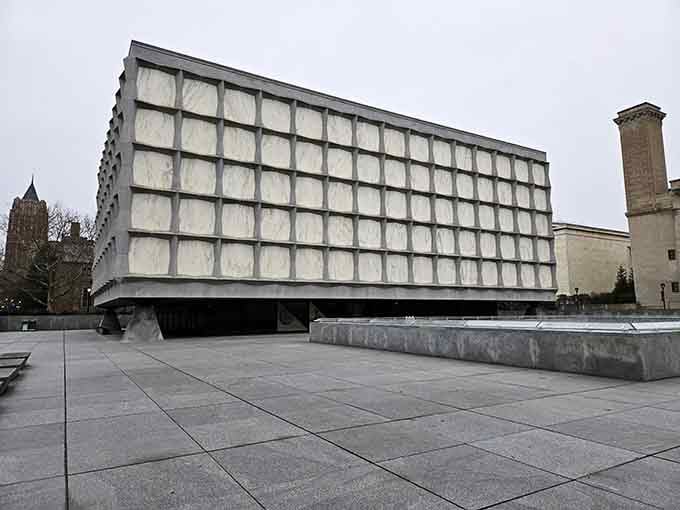 This modernist marble box glows like a giant lantern, protecting priceless literary treasures within its translucent walls.