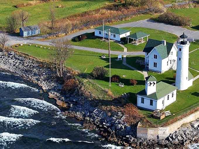 This lighthouse stands guard where river meets lake, a sentinel of solitude watching over Cape Vincent's peaceful shores.