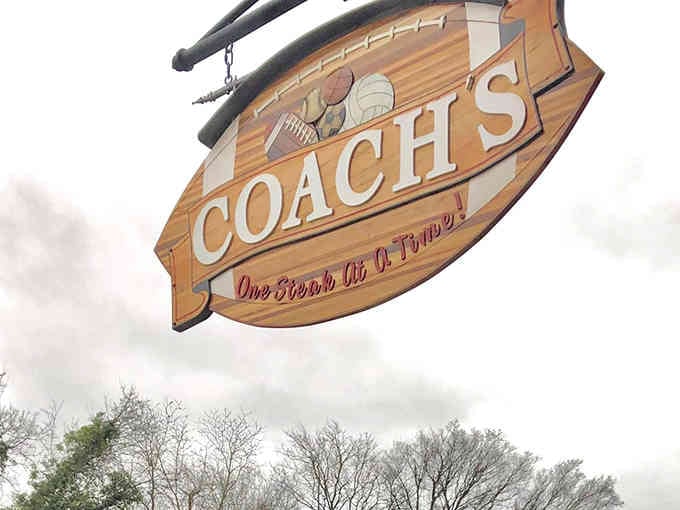 One Steak At A Time declares this hand-painted sign, revealing a philosophy of quality over speed.