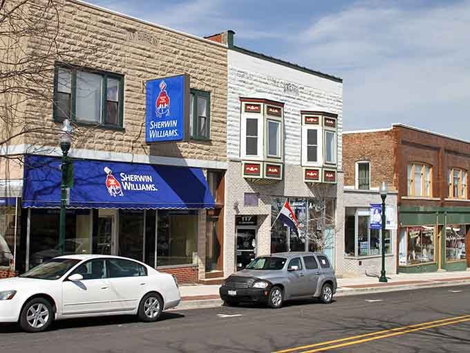 Small-town storefronts showcase local businesses where handshakes still seal deals and service means something more than transactions.