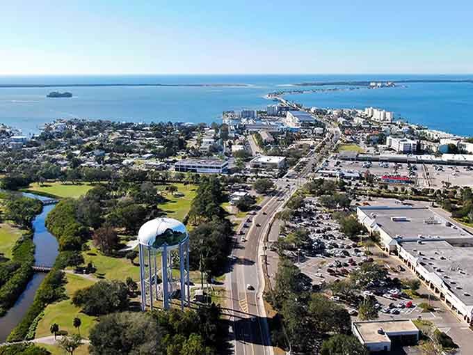 The water tower stands sentinel over Dunedin's charming streets, where coastal breezes keep everything fresh and inviting year-round.