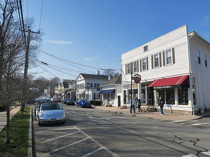 That red-striped awning on white clapboard signals the kind of local shop worth exploring thoroughly.