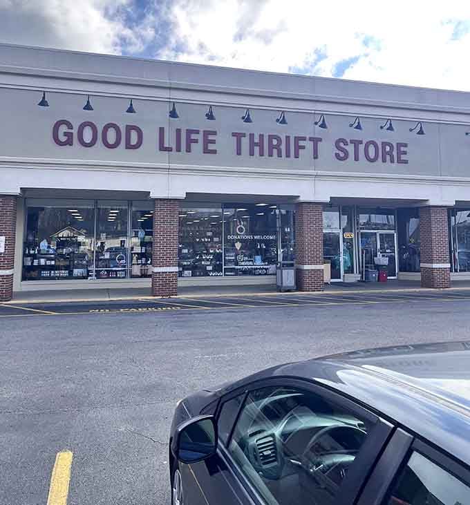 Clean white exterior and cheerful signage promise a pleasant shopping experience for budget-conscious families.