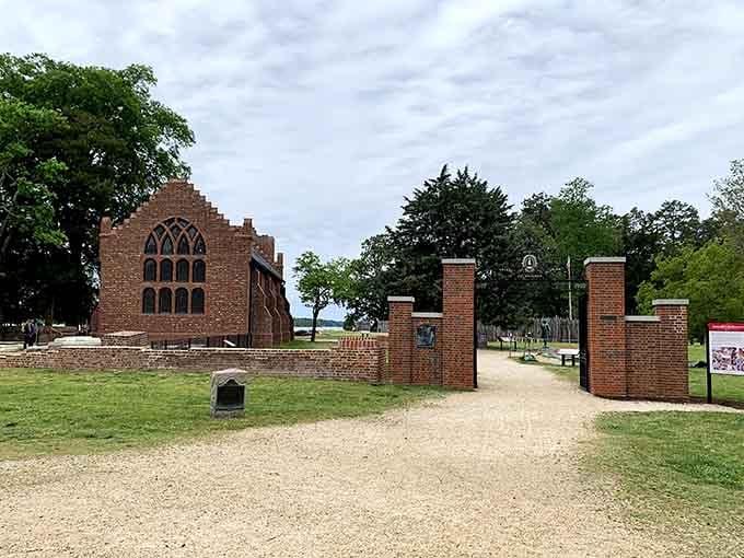 The brick church tower standing alone evokes centuries of English parish history in one powerful image.
