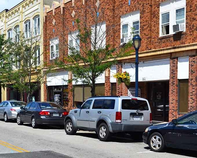 Brick buildings catch the afternoon light like they're posing for a postcard you'd actually want to send.