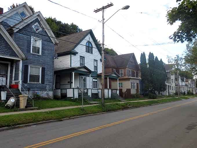 Victorian homes with turrets and gables show architectural ambition from an era when even modest towns built with style and permanence.