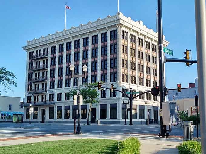 This grand white building anchors the corner with classic elegance, reminding you that affordable doesn't mean without character.