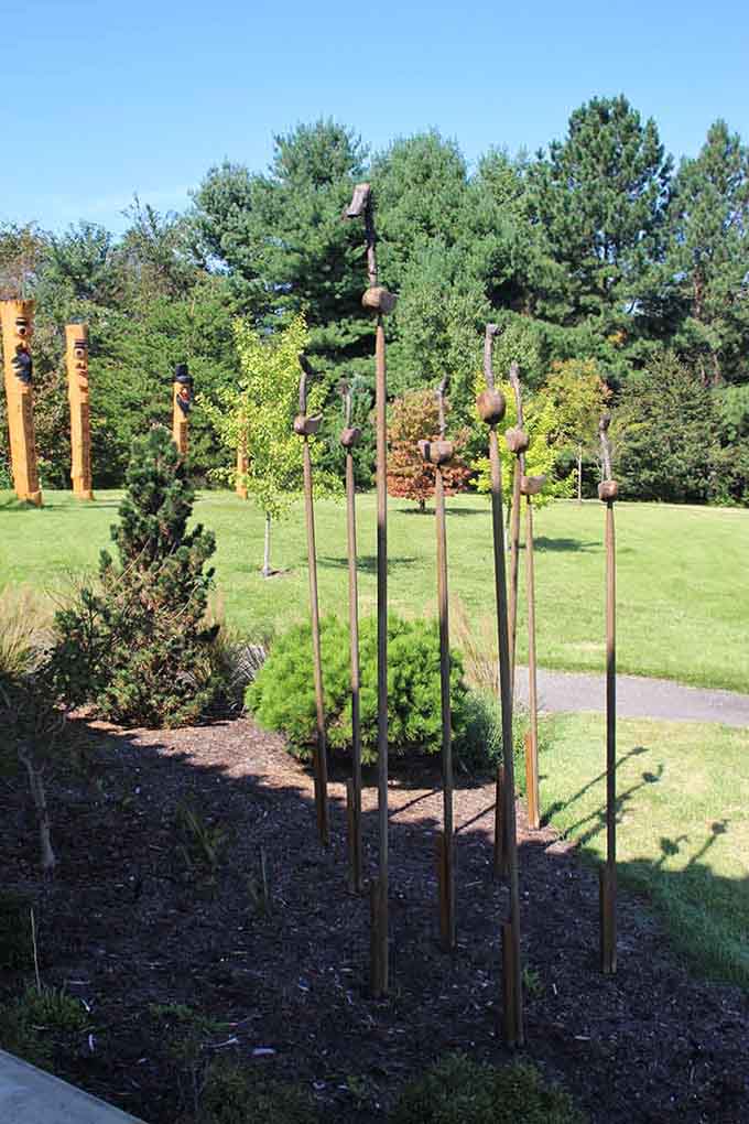 Sculptural poles rise from manicured gardens like a modern art installation that sparks curiosity and conversation among visitors.
