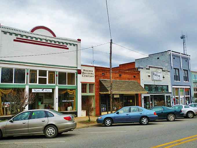 Historic storefronts wear their age like badges of honor, each building holding stories that beat any streaming service.