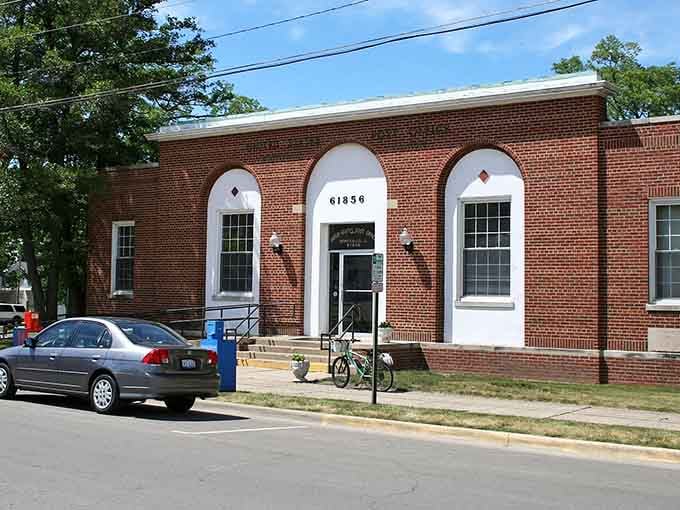 Those arched windows frame the street view better than any picture window in a modern McMansion ever could.