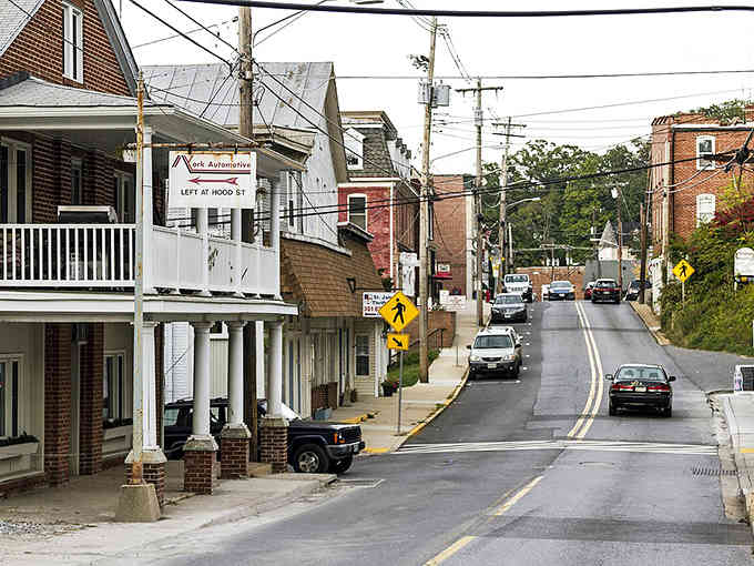 Mount Airy's hilly streets create that classic American small-town postcard view, where porches and steeples define the skyline.