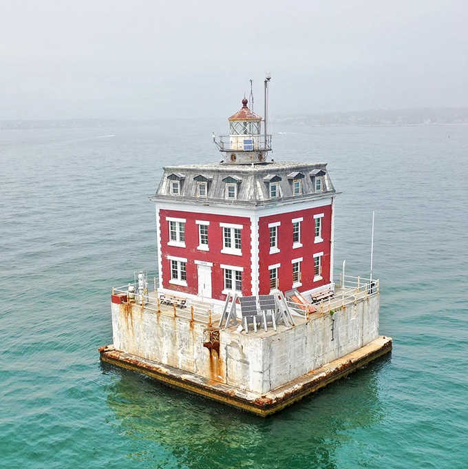 That bold red paint job makes this floating lighthouse impossible to miss, which is exactly the whole point.