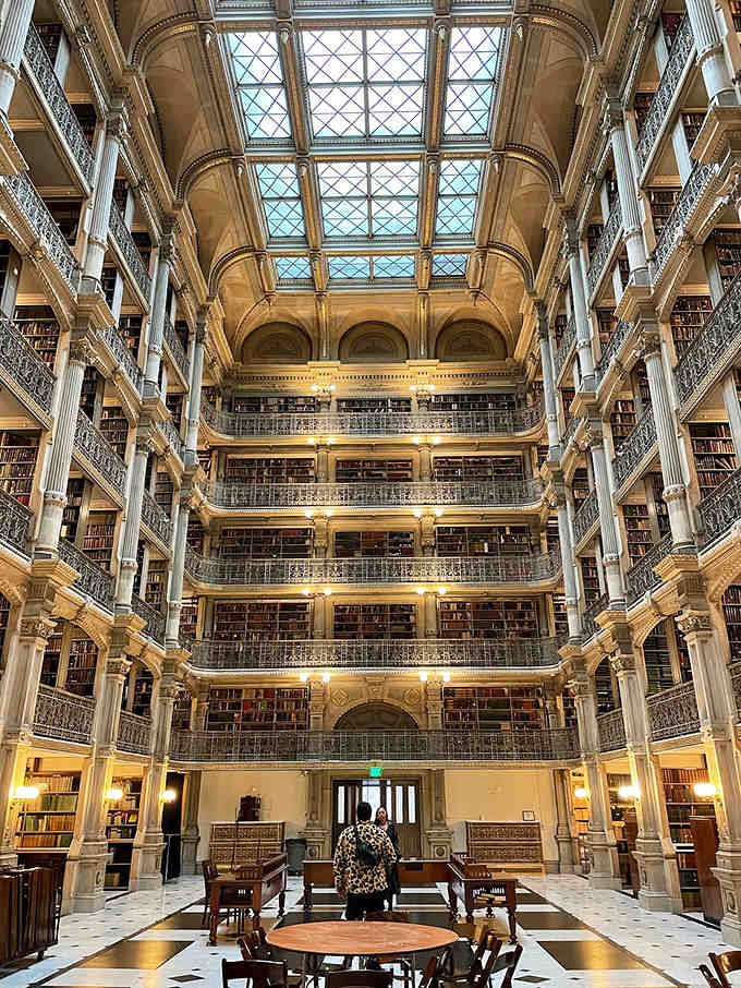 Those ornate iron railings and cream-colored columns create a symphony of architectural beauty that makes your heart skip.