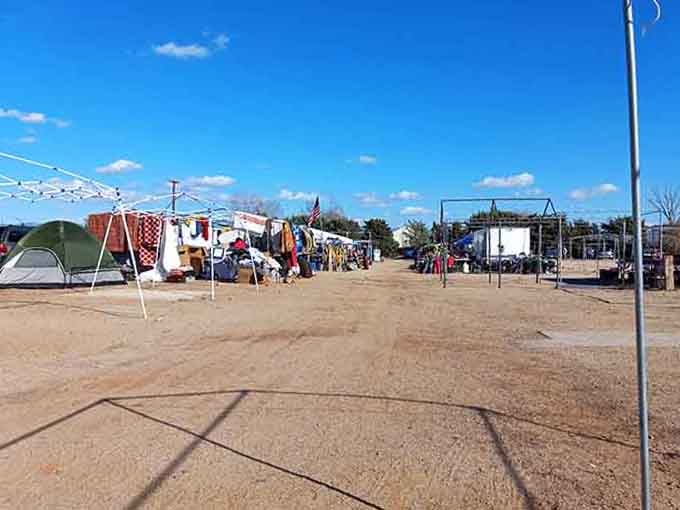 That open desert landscape dotted with vendor tents captures the authentic spirit of old-fashioned outdoor trading posts.