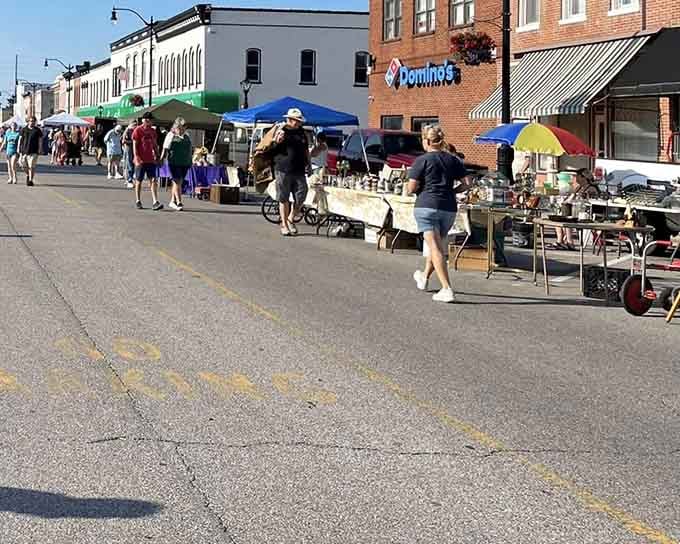 Vintage finds and quirky collectibles line the sidewalk where neighbors become friends over shared discoveries and good deals.