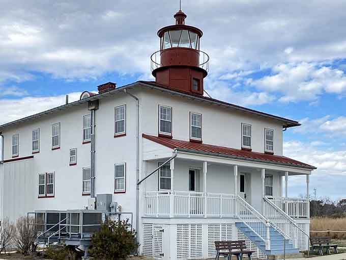 That crisp white exterior and red trim combination works better than any decorator's color wheel ever could suggest.