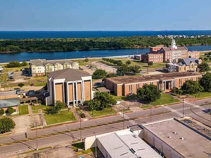 Waterfront views stretch toward the horizon, where blue meets green in this coastal community's peaceful setting.
