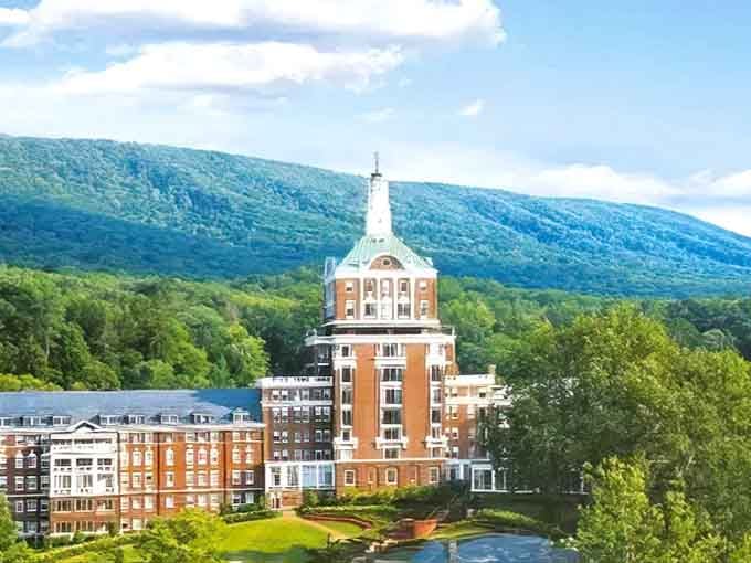 That grand resort building rises against the mountain backdrop like a wedding cake someone placed in the wilderness.