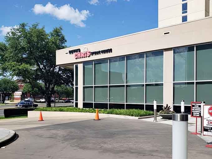 Modern glass and clean lines hide a classic steakhouse secret—this is where sizzling plates meet serious appetites in style.