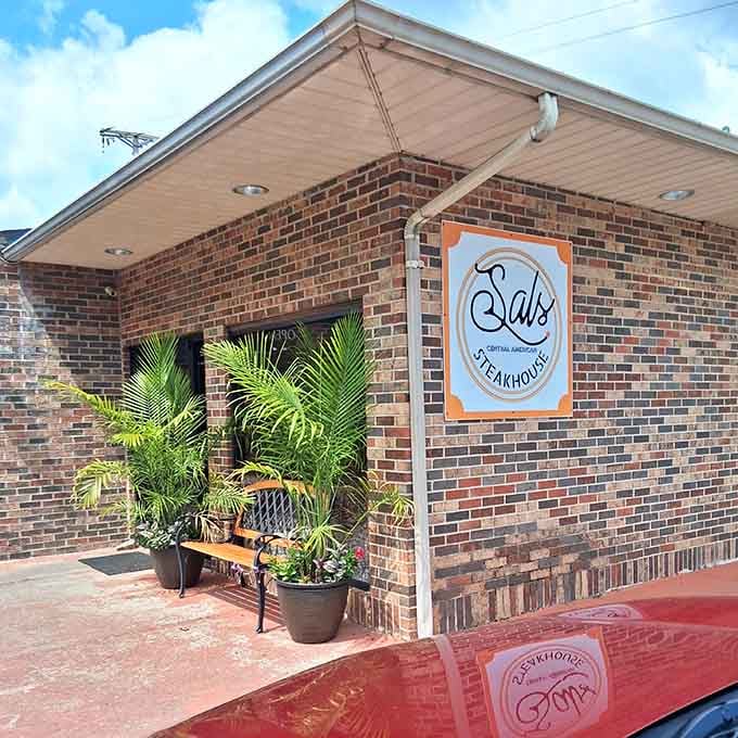 Tropical plants frame the entrance to this brick steakhouse, adding unexpected flair to Eastern Kentucky dining.