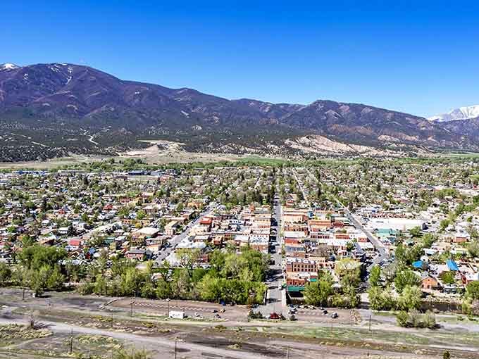 Mountain peaks embrace this charming town from every direction, creating a natural amphitheater that's pure Colorado magic at its finest.