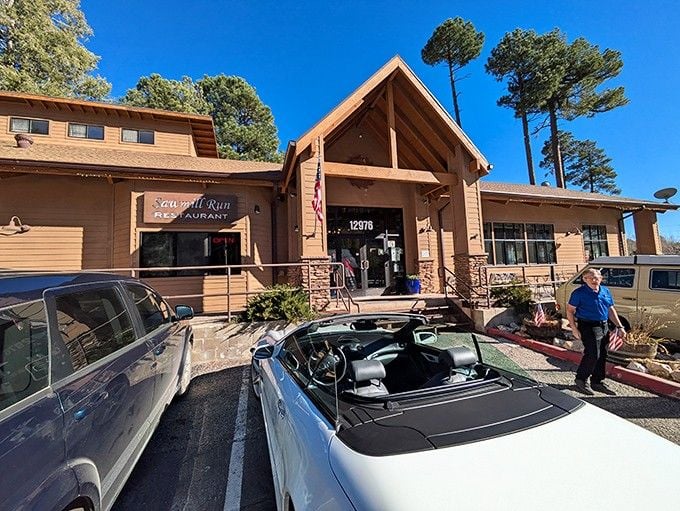 The mountain lodge architecture with its peaked roof and busy parking lot signals a local favorite worth finding.