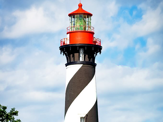 Up close, those spiral stripes and brilliant red top create a candy-cane effect that's both playful and purposeful against the sky.
