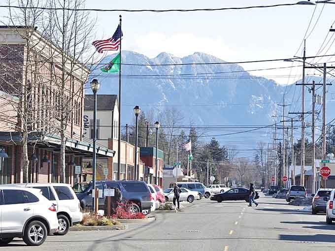 Snow-dusted peaks frame downtown streets where mountain air tastes crisp as your grandmother's apple pie cooling on the windowsill.