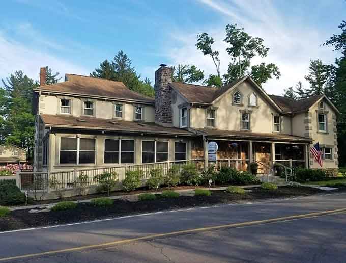 This historic building's weathered charm and stone chimney hint at generations of memorable meals shared within its welcoming walls.