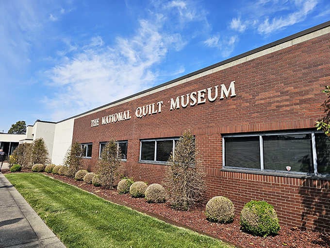 The clean brick facade welcomes visitors to discover textile artistry that'll change how you think about quilts.