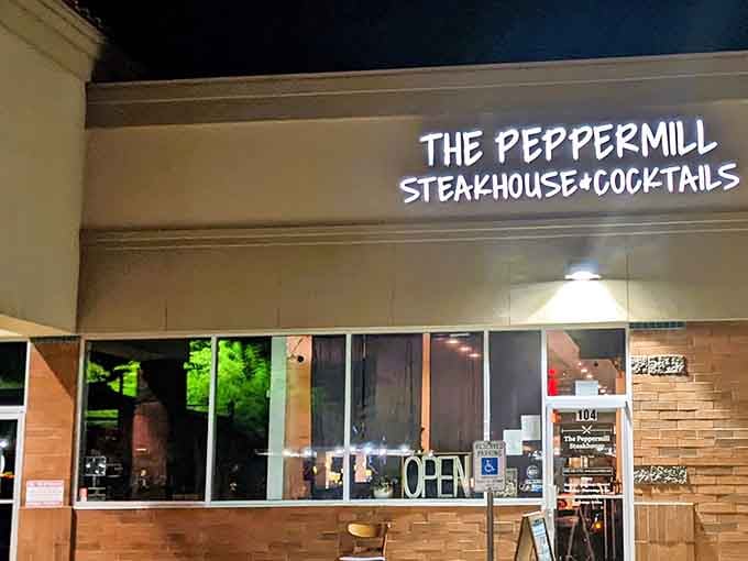 The Peppermill's modern storefront promises classic steakhouse elegance where cocktails and prime cuts create perfect harmony together.