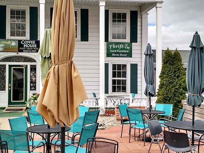 Charming outdoor seating with turquoise chairs invites you to relax after scoring incredible deals inside.