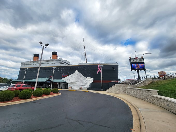 The ship's imposing hull rises dramatically against stormy skies, recreating that fateful voyage with remarkable attention to historical detail.