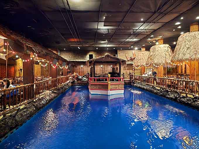 An indoor lagoon with a floating stage sounds impossible until you're actually sitting there watching it happen.