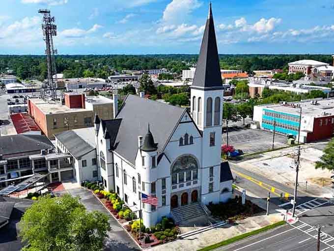 That striking white church rises like a beacon, its steeple pointing skyward above a downtown that values tradition.